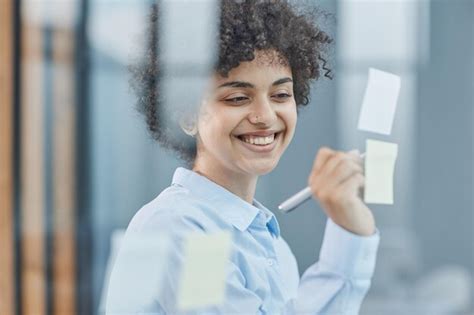 Premium Photo A Girl In A Modern Office Behind Glass Uses Sticky