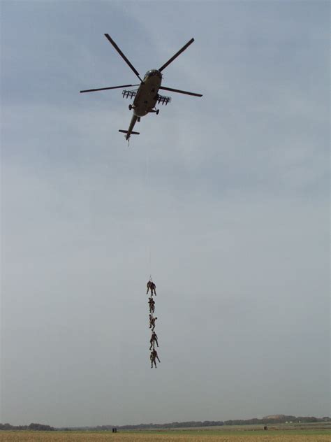 Irish Army Rangers And Belgian Sfg Operators Training For Spie Rig Extractions Under A Hip Helo