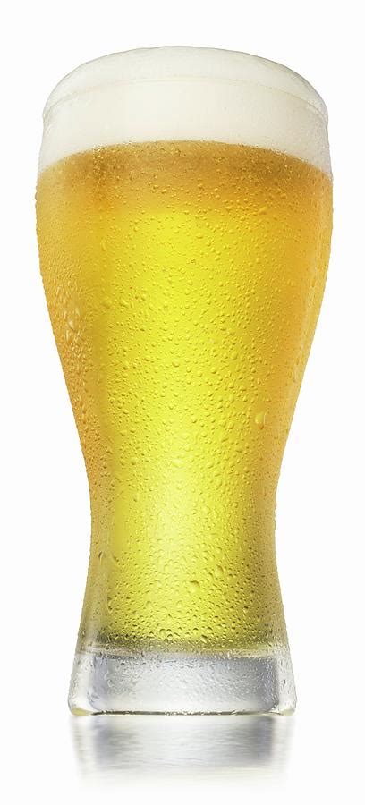 A Full Glass Of Beer With Water Droplets And A Head Of Foam Photograph