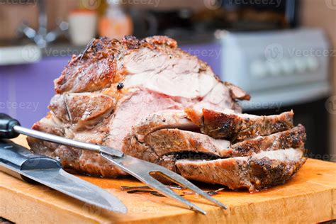 Baked Pork Meat With Spices On Brown Wooden Cutting Board 15591896