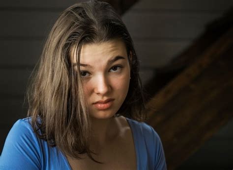 Premium Photo Portrait Of Girl Making Irritating Face With Raised Eyebrow