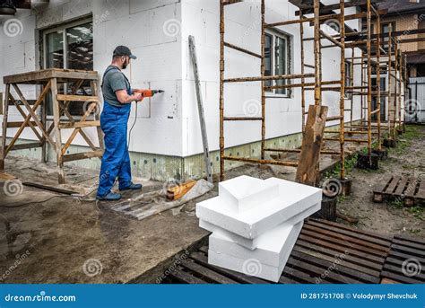 Worker Makes Building Insulation Saves Energy With Styrofoam Stock