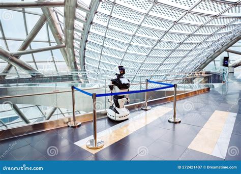 Robot In Full Growth In Museum Energy Of Future Glass Dome With Solar Panels Autonomous