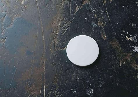 Download White Circular Object On Aged Black Surface Mockups Online Creative Fabrica