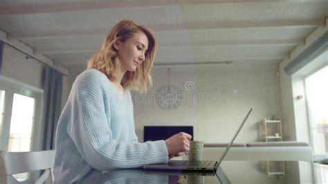 Young Cute Smiling Woman Typing In Notebook And Looking In The Camera Stock Footage Video Of