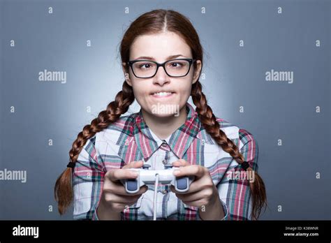 Nerd Woman With Braid Playing Videogames With A Joypad Stock Photo Alamy