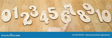 Wooden Jigsaw Digits From 0 To 10 On Natural Wood Table Stock Image