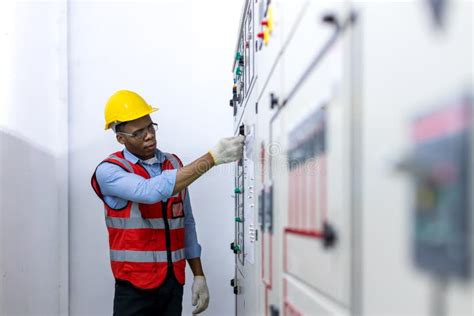 Electrical Engineer Working In Control Room Electrical Engineer Man Checking Power Distribution