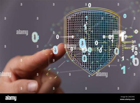 Closeup Of The Hand Touching The Virtual Shield With Binary Numbers
