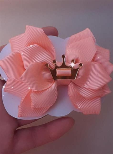 A Pink Bow With A Crown On It