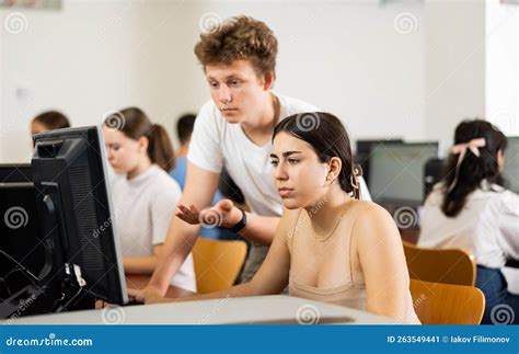 teenagers using computer during computer science lesson stock image