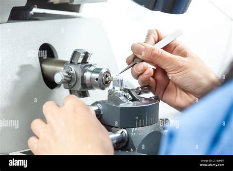 Closeup Of A Female Scientist Placing A Sample On A Transmission