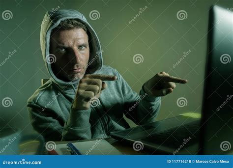 Dangerous Looking Hacker Man In Hoodie Hacking Internet Computer Stock