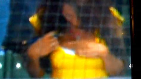 The Woman In The Yellow Shirt Behind Home Plate At The Brewer Game