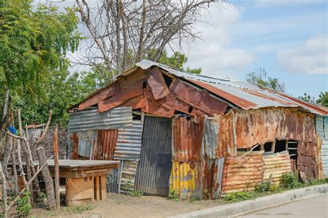 An Old Shack With A Rusty Roof And A Broken Door Photo Poor Image On