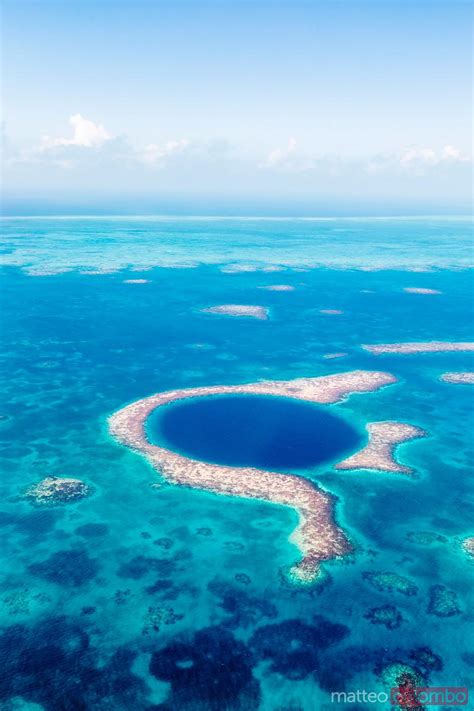 Aerial View Of The Great Blue Hole Lighthouse Reef Belize Royalty