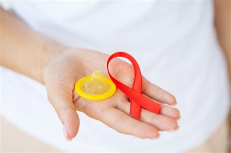 Premium Photo Attractive Businesswoman With Red Ribbon And Condom