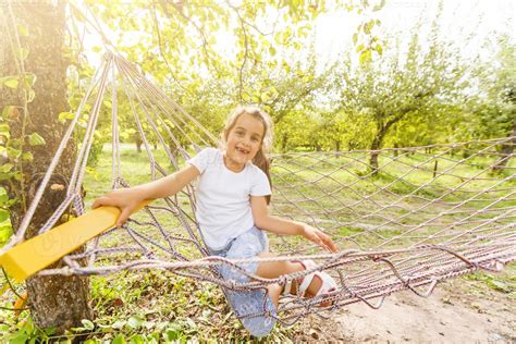 Cute Girl In The Net Hammock 16779697 Stock Photo At Vecteezy