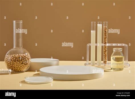 A Set Of White Podiums Arranged With Laboratory Glassware Filled With