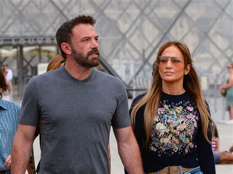 Ben Affleck Looks At His Phone While Kissing Wife Jennifer Lopez