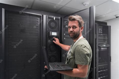 premium photo data center engineer using laptop computer server room
