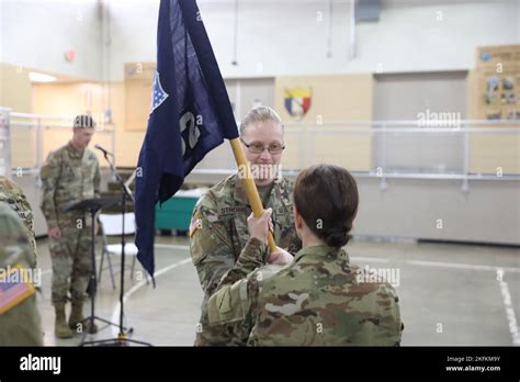 First Sgt Angela Wilkins Hands The Guide On To Warrant Officer