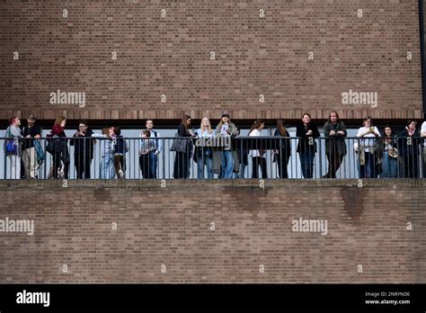 People Looking Across The River Thames From The Outside Viewing Area