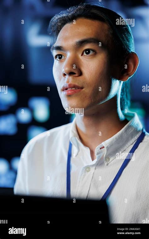 Portrait Of Technician Between Server Hub Clusters Providing Processing