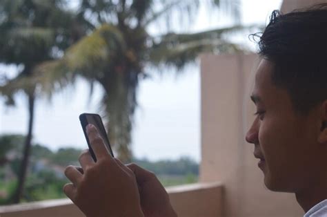 Premium Photo Side View Of Man Photographing Through Smart Phone