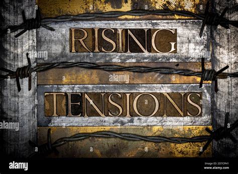 rising tensions text formed with real authentic typeset letters