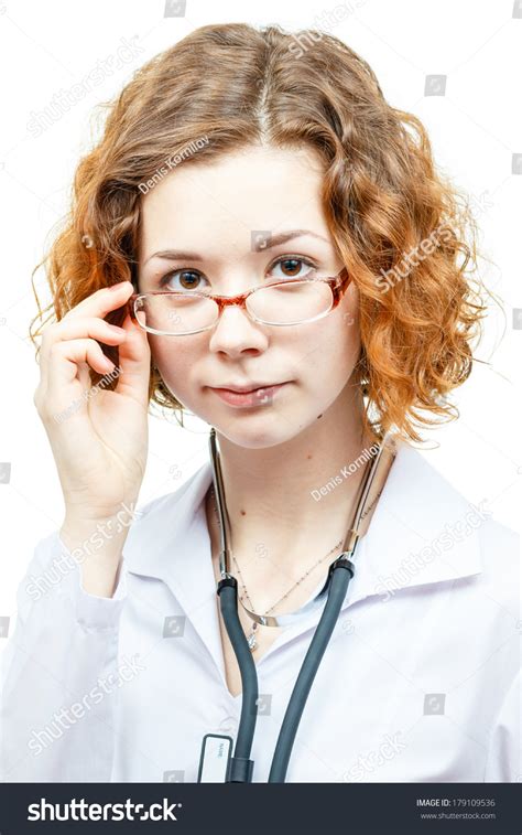 Cute Redhead Doctor In Lab Coat With Glasses Isolated On White