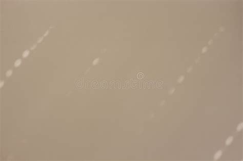 Diagonally Directed Shadows In The Form Of Blurry Small Ovals Dynamic Lines Or Rays On A Beige