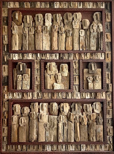 Countless Astonished Faces Emerge From Driftwood In Expressive