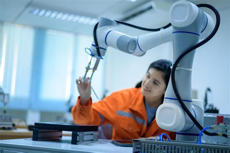 Female Robotics Engineer Working With Programming And Manipulating