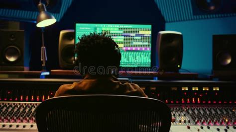 Music Producer Recording And Editing Tracks In Control Room Stock Video
