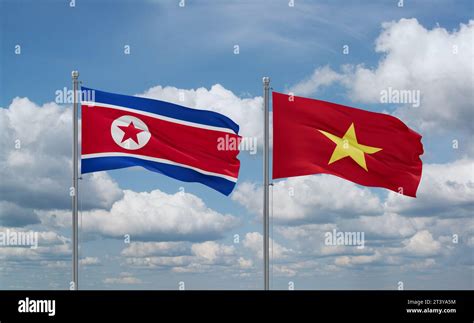 Vietnam And North Korea Flags Waving Together In The Wind On Blue