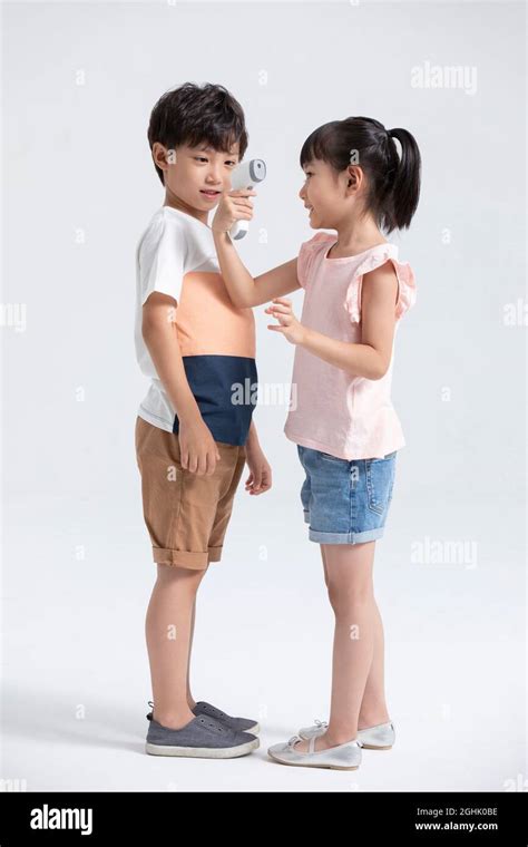 Measuring Temperature With Infrared Thermometer Stock Photo Alamy