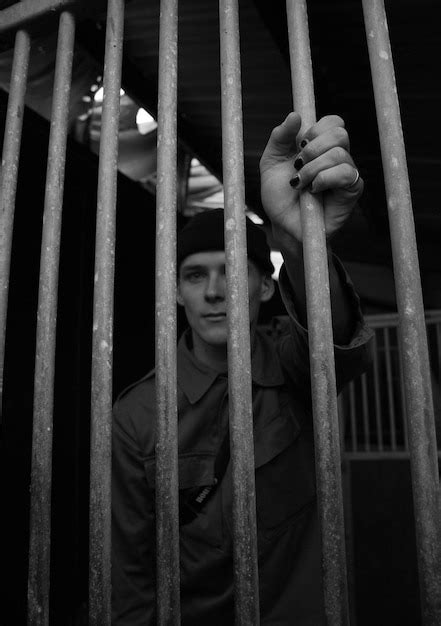 Premium Photo Portrait Of Man Holding Security Bars