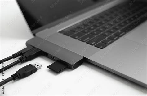 Laptop With Usb Type C Adapter With Pluged Usb Cables And Sd Card The Usb Adapter Under The