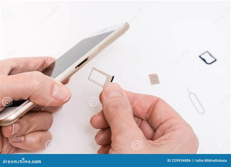 Removing A Sim Card Out Of A Smartphone Replacing Simcard And Changing Number Stock Photo