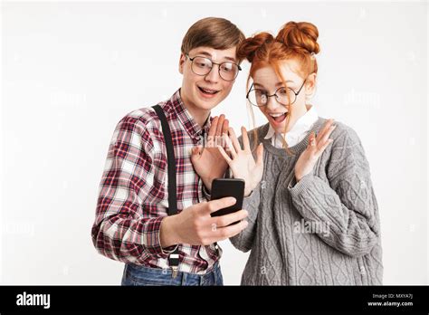 Cheerful Couple Of School Nerds Taking Selfie With Mobile Phone Isolated Over White Background