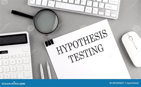 Hypothesis Testing Written On Paper With Office Tools And Keyboard On The Grey Background Stock