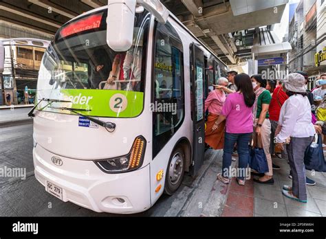 Passengers Boarding Electric Shuttle Bus At Terminus Bangkok Thailand