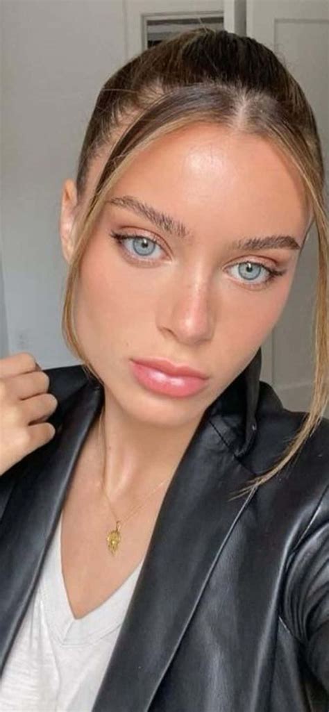 Download Woman With Blue Eyes And Leather Jacket Wallpaper