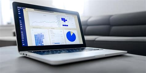 Laptop Displaying Charts And Graphs Premium Ai Generated Image