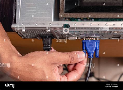 Top View Brunette Male Hand Installing Vga Cable In Computer Technology And Technical Service