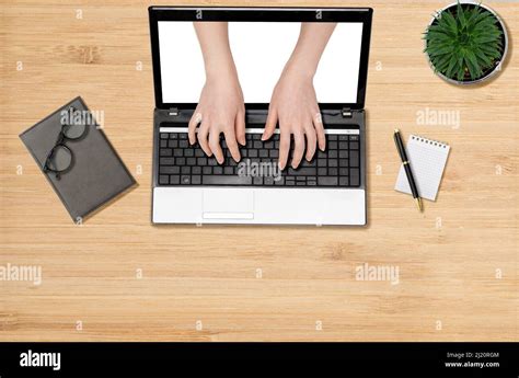 Womens Hands Are Typing On A Laptop Appearing From A Computer Screen