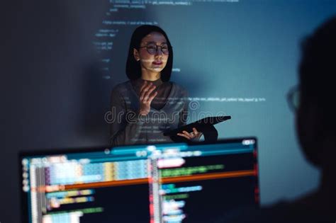 Asian Woman Developer Presentation About Coding Software Data With Devops Team At Night In