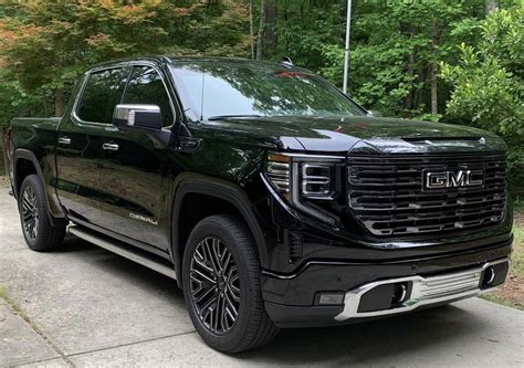 Gmc Sierra 1500 Denali Ultimate Black Truck Parked On The Side Of The