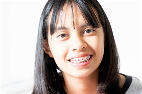 Premium Photo Dental Brace Girl Smiling And Looking To Camera She